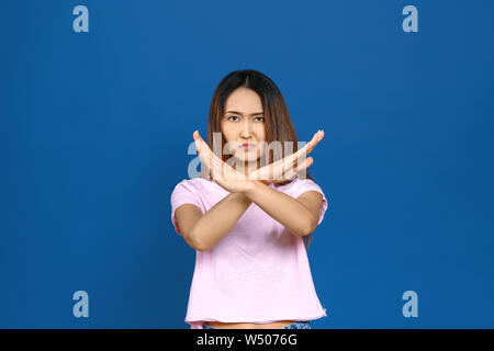 Asian woman rejecting something on color background Stock Photo - Alamy