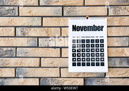 Flip calendar hanging on wall Stock Photo - Alamy