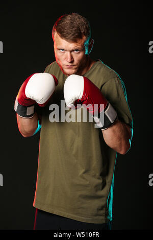 Strong male boxer on dark background Stock Photo - Alamy