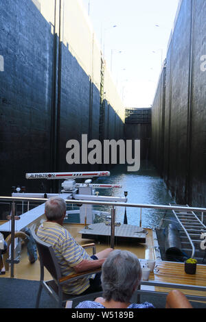 A riverboat negotiating the lock chamber at Bollene on the River Rhone ...