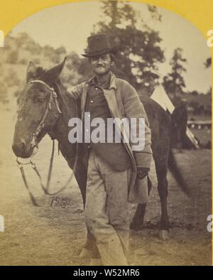 Fred. W. Loring, in his campaign costume, with his mule "Evil Merodach ...