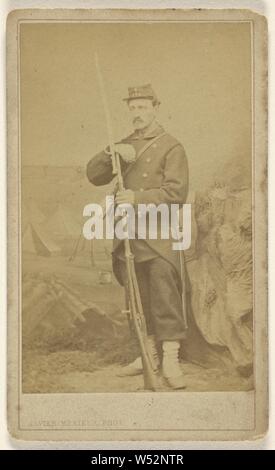 Unidentified soldier with moustache, holding rifle with bayonet ...
