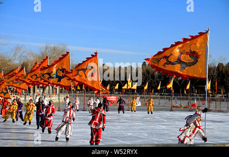 Entertainers dressed in helmets and armor in the style of Manchu ...