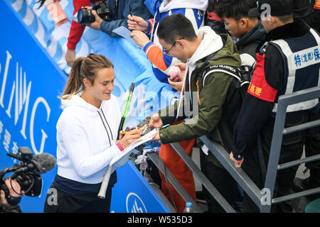 Aryna Sabalenka of Belarus signs autographs after winning in the Women ...