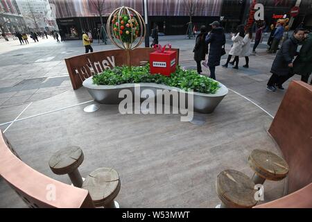 A large, open air smoking area featuring 18 stainless steel seats, 13 ...