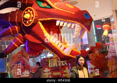 A model of a Chinese dragon spiralling up a pillar, constructed with ...