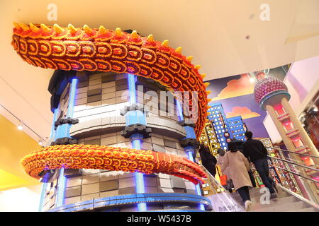A model of a Chinese dragon spiralling up a pillar, constructed with ...