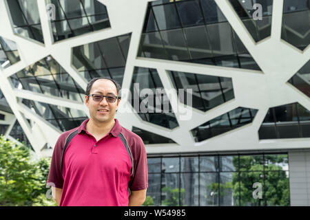 --FILE--Guo Dongbai, CTO at AliExpress, poses for photos during an ...