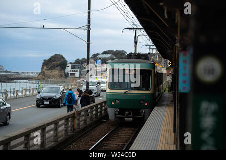 A train on the Enoden Line enters the Kamakura-Koko-Mae Station by the ...