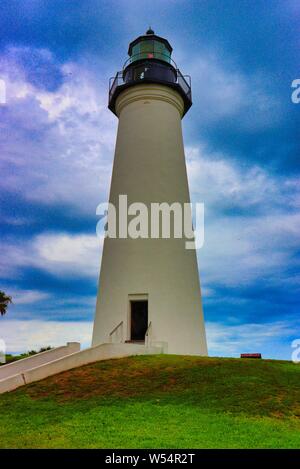 Lighthouse on the coast on a cloudy day Stock Photo - Alamy