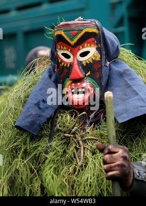 People of the Miao ethnic group dress up as "Manggao", a legendary ...