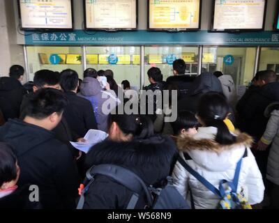 Patients crowd the First Affiliated Hospital of Zhengzhou University in ...