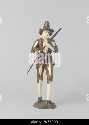 Begging figure with stick. Beggar with stick Stock Photo - Alamy