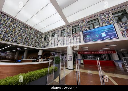 Thousands of old books are placed to create the "walls" at the library ...