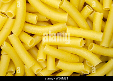 Lot of whole raw pasta macaroni copyspace in the middle of a circle ...