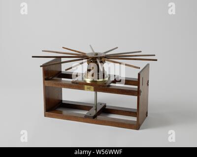 Model or a capstan. Model of a capstan in a wooden frame that ...