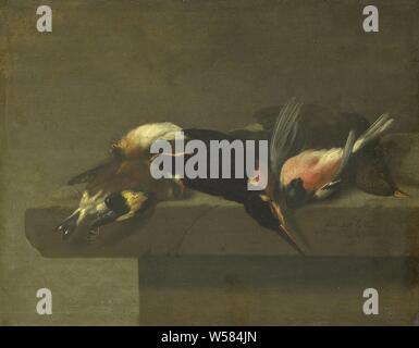 Dead Birds. Still life of a group of dead birds lying on a stone plinth ...
