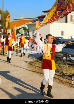 Traditional italian festival with flag throwers.Flags on the blue sky ...