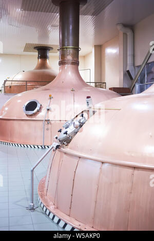 Equipment for preparation of beer. Lines of cooper tanks in brewery ...