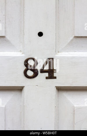 House number eighty on wooden wall close-up Stock Photo - Alamy