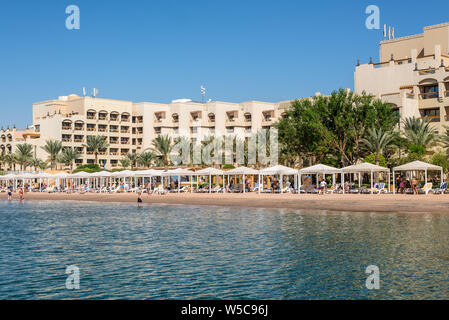Aqaba, Jordan - November 6, 2017: People walk along the promenade on ...