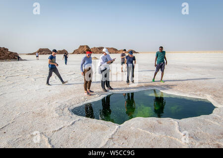Water of Lake Karum, visible through a hole in the salt flat, Danakil ...