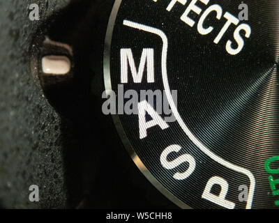 Macro of a Nikon DSLR camera mode dial turned on manual mode Stock ...