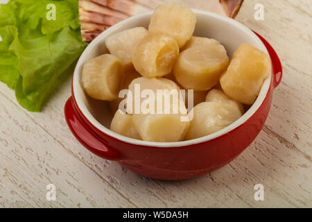 Raw scallops heap in the bowl ready for cooking Stock Photo - Alamy
