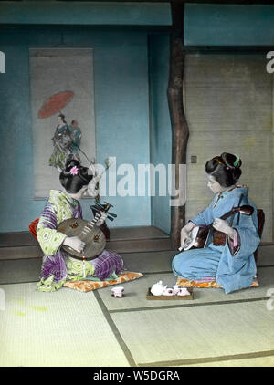 Geisha playing instrument on japanese postage stamp Stock Photo - Alamy