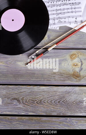 Sheets with music notes and vinyl record. Compose music concept Stock ...