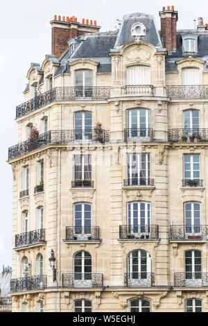 Elegant Haussmann apartment buildings with balconies and iron railings ...