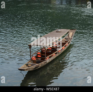 Hunan, China - Nov 6, 2015. Wooden boats on the main canal at Fenghuang ...