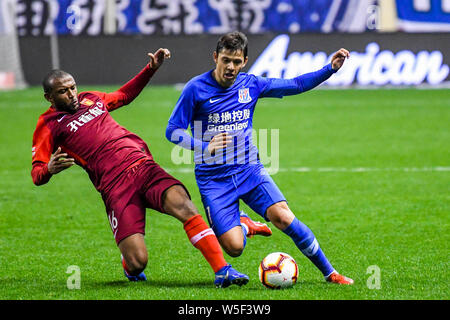 Moroccan football player Ayoub El Kaabi, top, of Hebei China Fortune ...