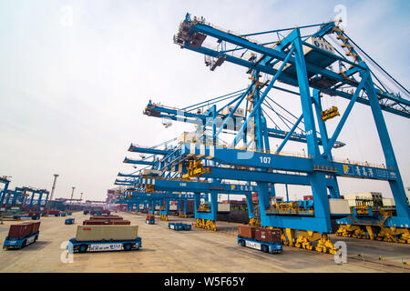 --FILE--An aerial view of containers stacked at the fully automated container terminal at the ...
