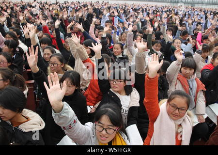 Chinese students attend a mass rally for the upcoming annual college ...