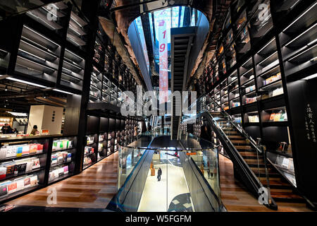 Books are on display on the giant book shelf, which spans 240 meters ...