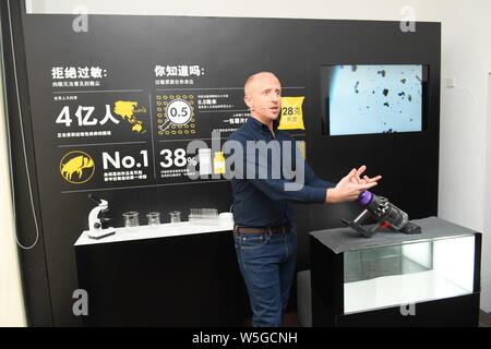 Kevin Grant, Head of Floorcare at Dyson in Southeast Asia, demonstrates ...