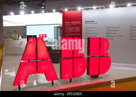 --FILE--People visit the stand of ABB Group during the Industrial ...