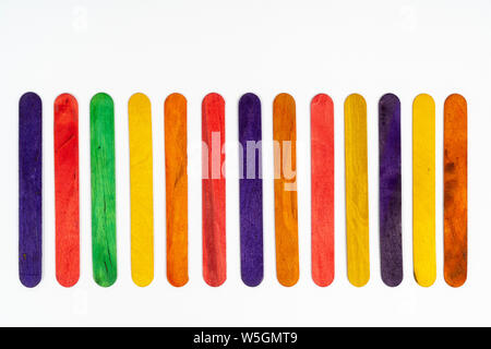 row of colored wooden slats on a white surface Stock Photo - Alamy