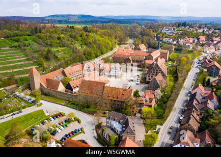 Germany, Baden-Wurttemberg, Drone view of sun setting over town in ...