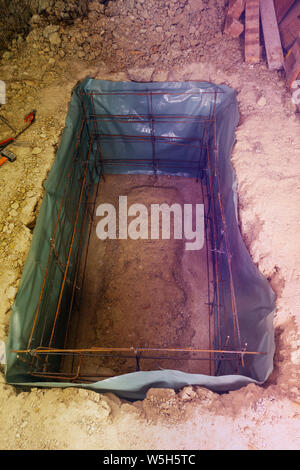 Framework of metal bars prepared for cellar basement concrete pouring ...