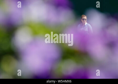 Generic detail of flowers and a court official line judge at The ...