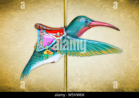 Carnival carousel hummingbird isolated on green background Stock Photo ...