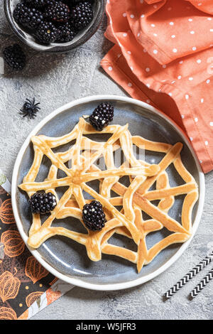 Spider web pancakes with blackberry for Halloween breakfast Stock Photo ...