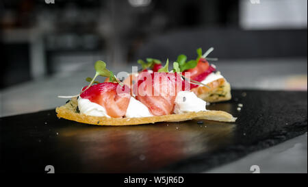 Delicious amuse bouche appetizer, cured salmon with beetroot, cheese ...