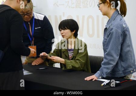 Japanese pop female singer-songwriter Anri Kumaki attends a signing ...