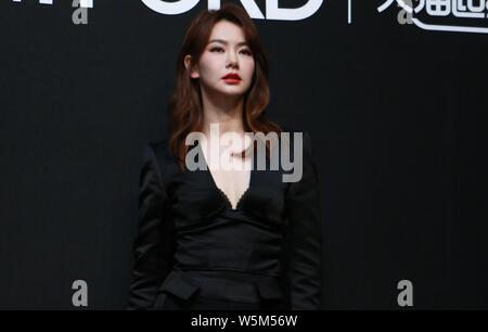 Chinese actress Stephy Qi (Qi Wei), right, and her South Korean singer ...
