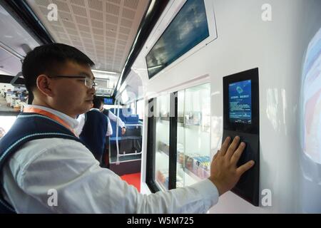 A Smart Panda Bus autonomous vehicle developed by DeepBlue Technology ...