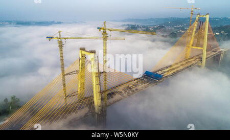 Aerial view of the Qujiang Bridge under construction in Guangan city ...