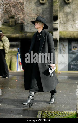 A trendy woman poses for street snaps during the Paris Fashion Week ...